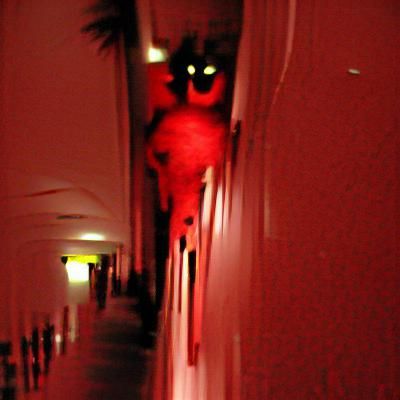 bright red horrifying demon eyes in a dark corridor - AI Generated ...