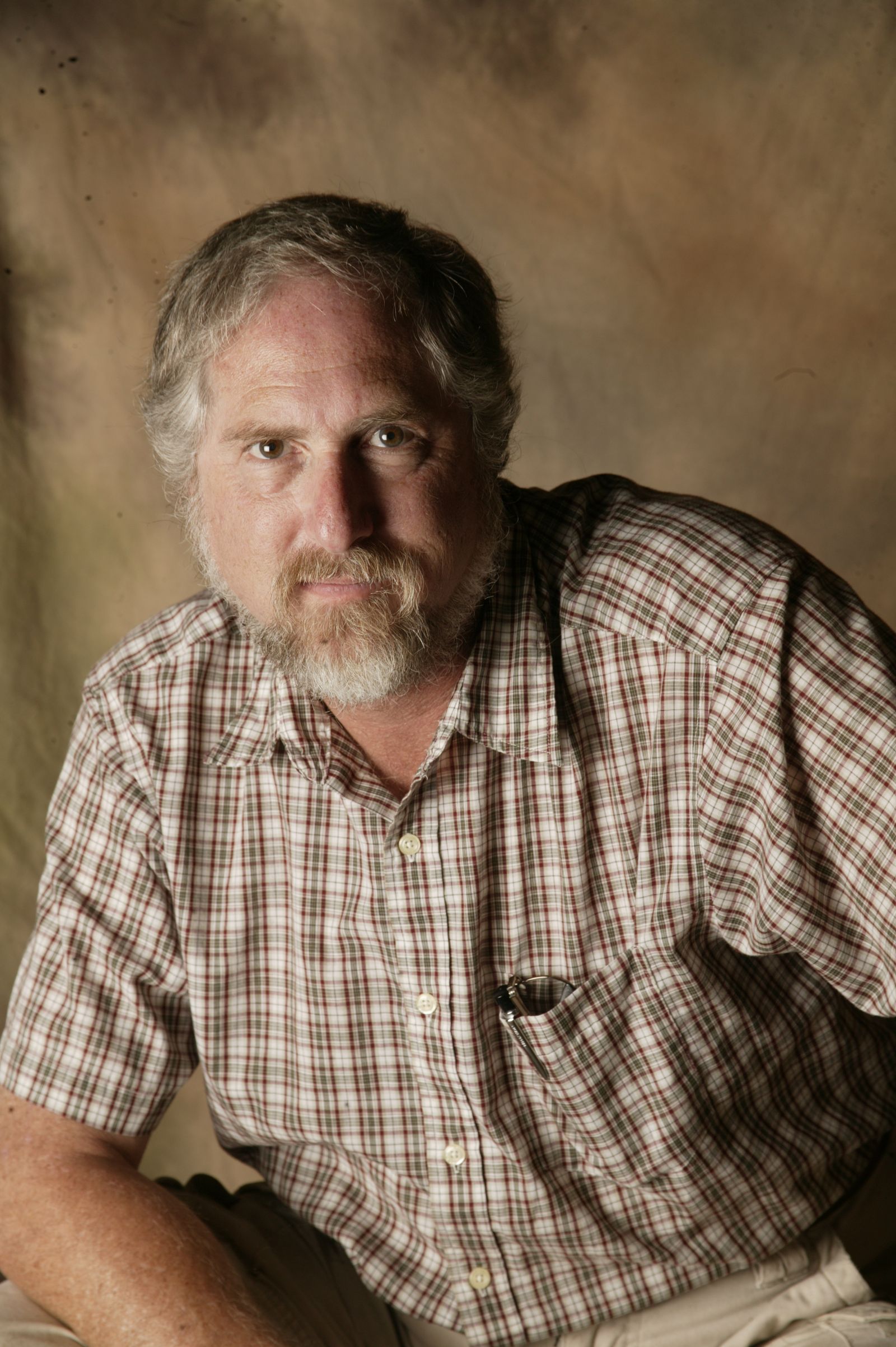 Two men only playing pool in a darkened poolhall. Dramatic focused ...